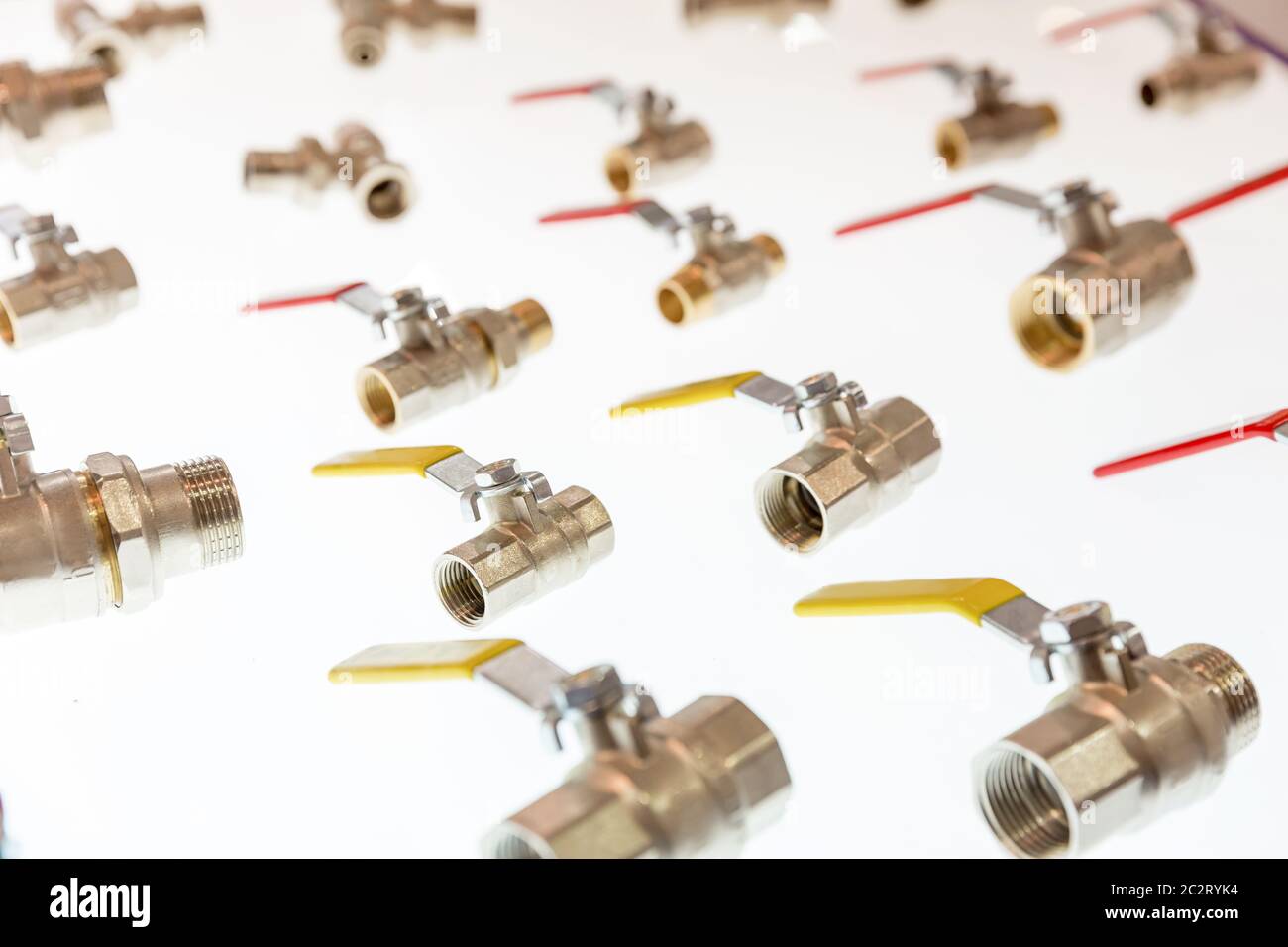 Different valves and other plumbing equipment on the wall Stock Photo ...