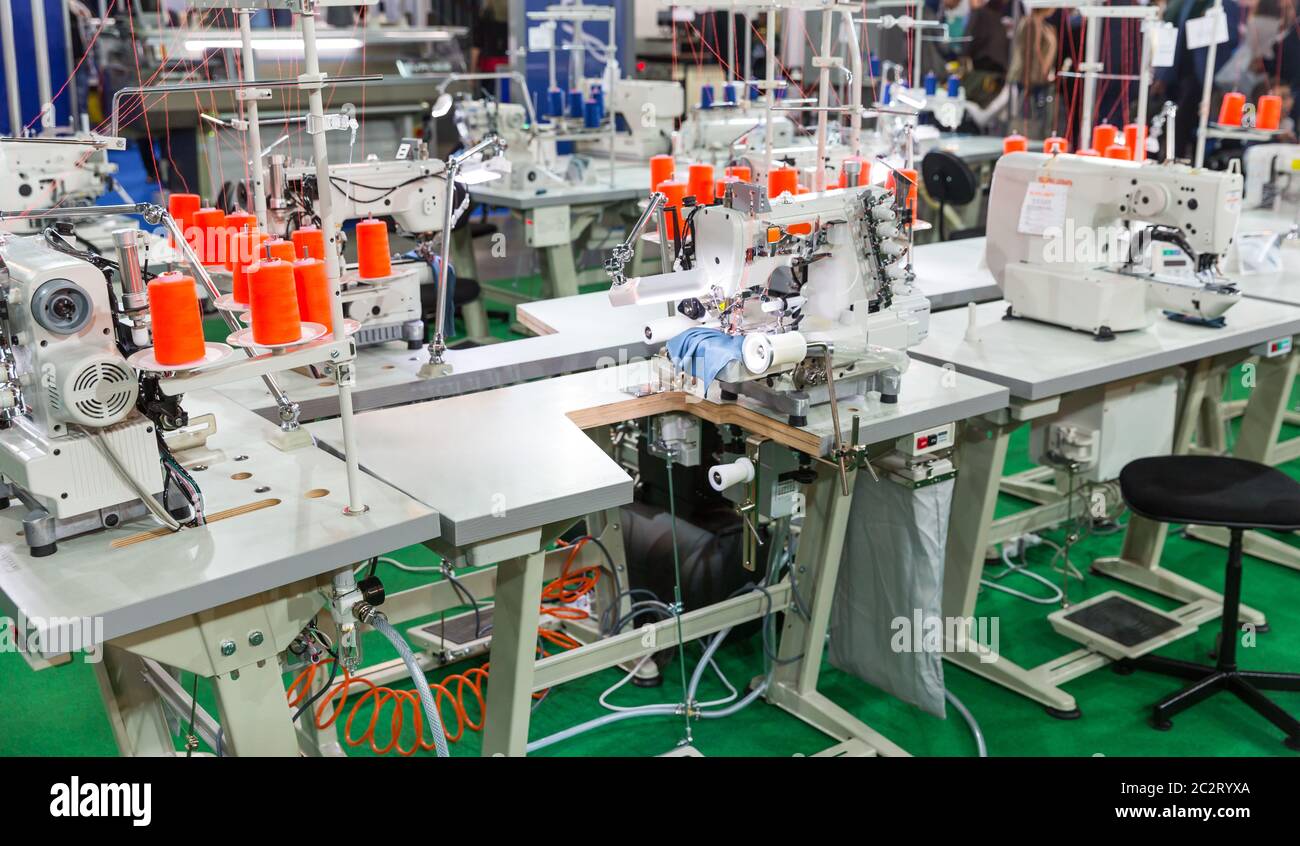 Sewing factory, nobody, overlock, stitching machines. Clothing sew ...