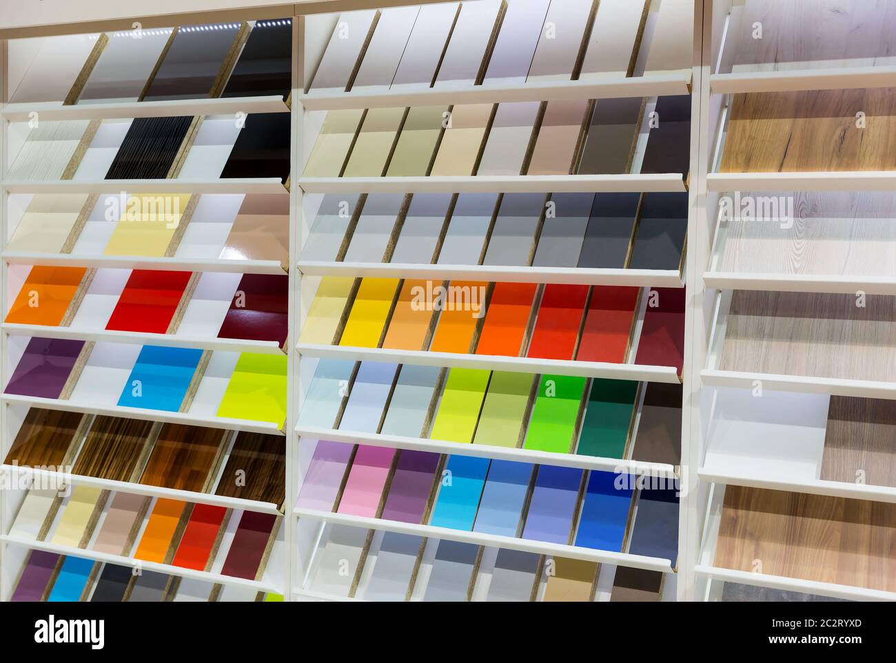 Shelf with many multicoloured wooden samples Stock Photo - Alamy