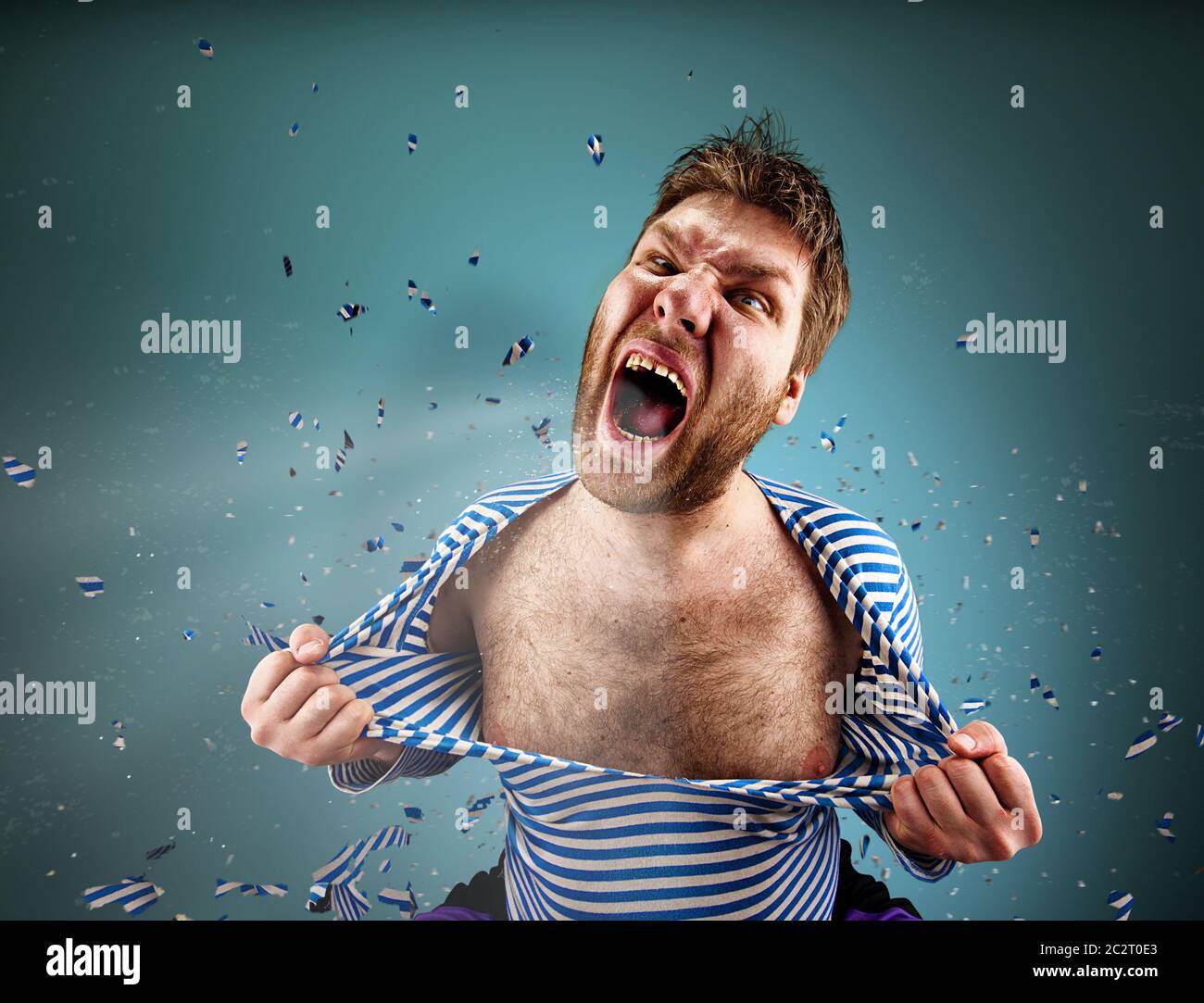 Furious man is tearing clothing on himself and are screaming Stock ...