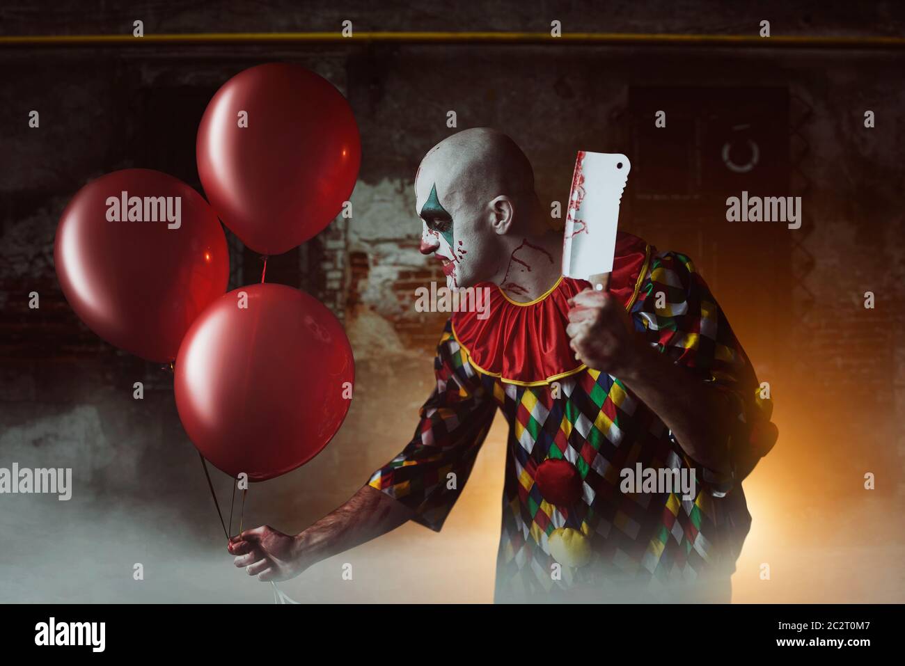 Scary bloody clown with meat cleaver and air balloon sneaking into the ...