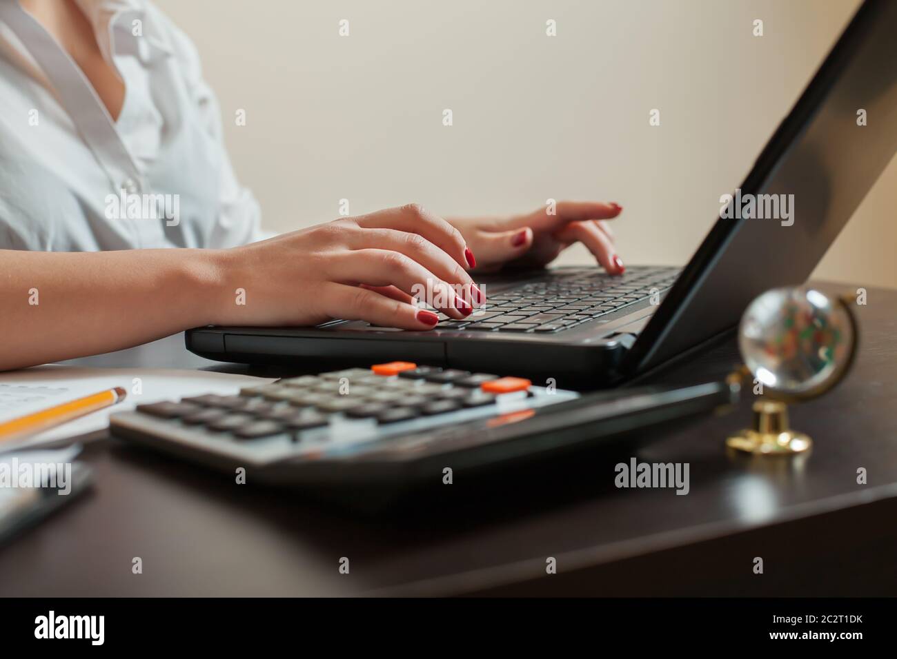 Female accountant hands on keyboard, calculator, laptop and accounting ...