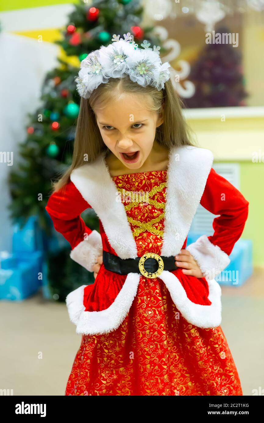 Angry little girl at Christmas party Stock Photo - Alamy