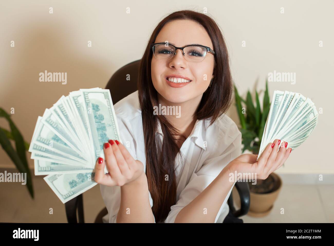 Business woman with money fans in hands. Happy female accountant ...