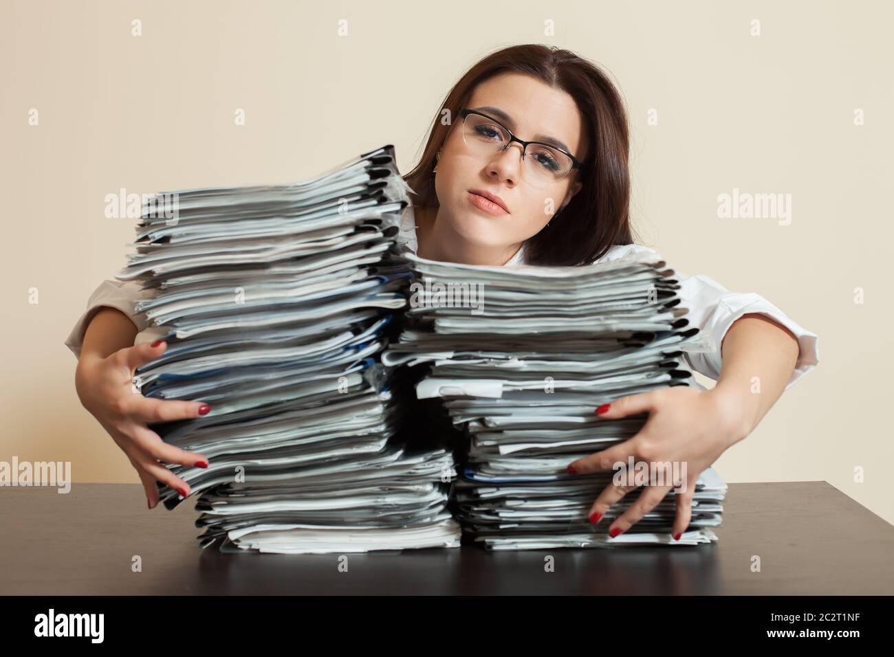 Person big stack of paper hi-res stock photography and images - Alamy