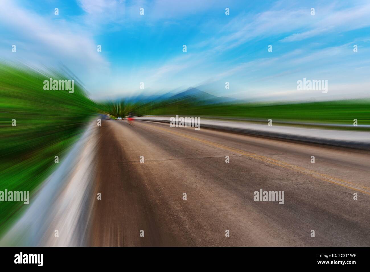 Blurred asphalt road blurred blue sky background Stock Photo - Alamy