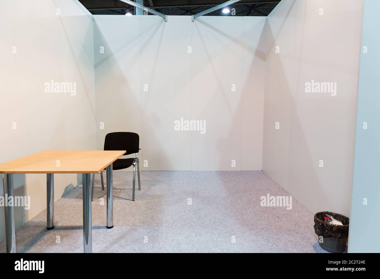 Table and chair in a small empty room Stock Photo - Alamy