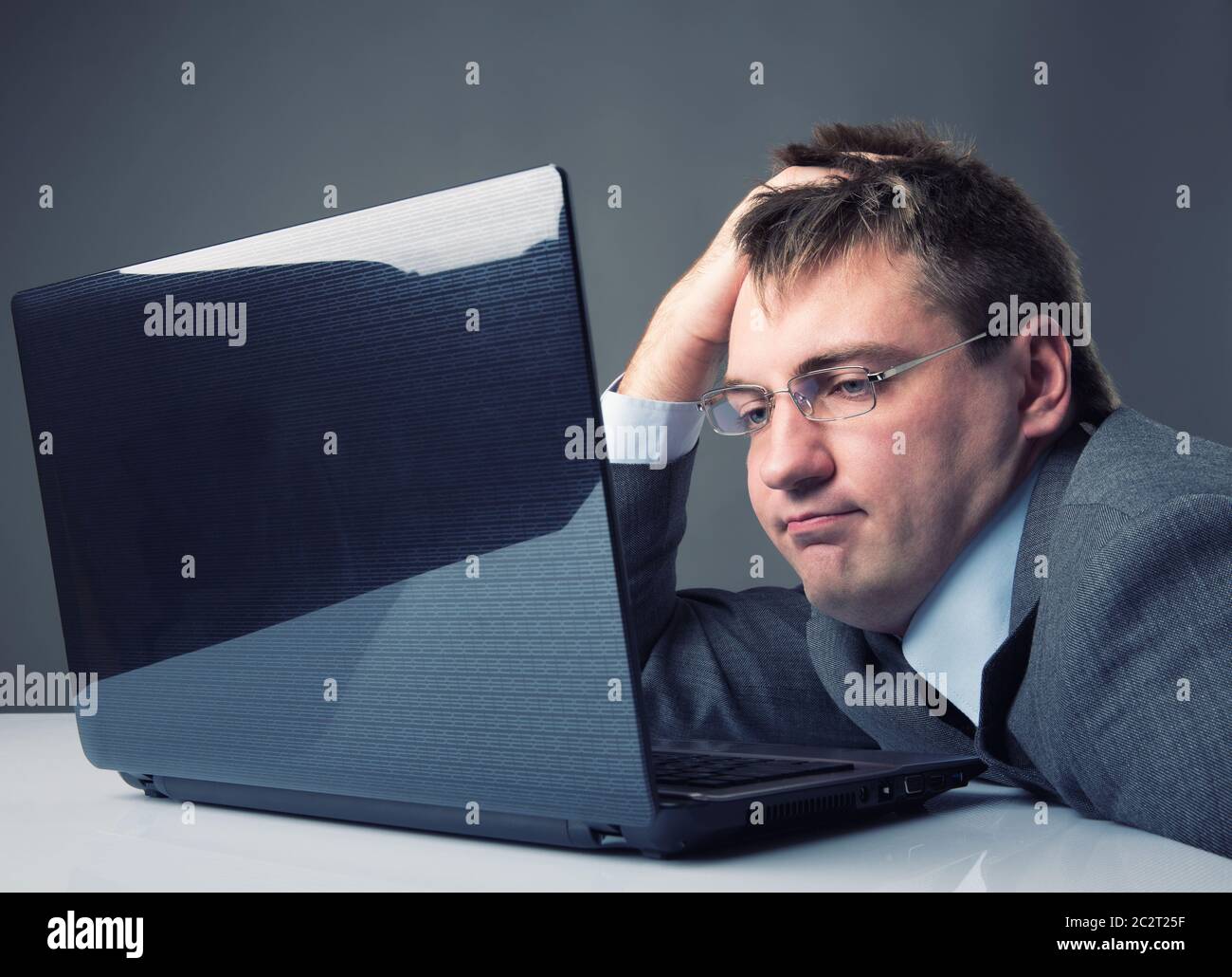 Office worker asleep on a laptop keyboard Stock Photo - Alamy