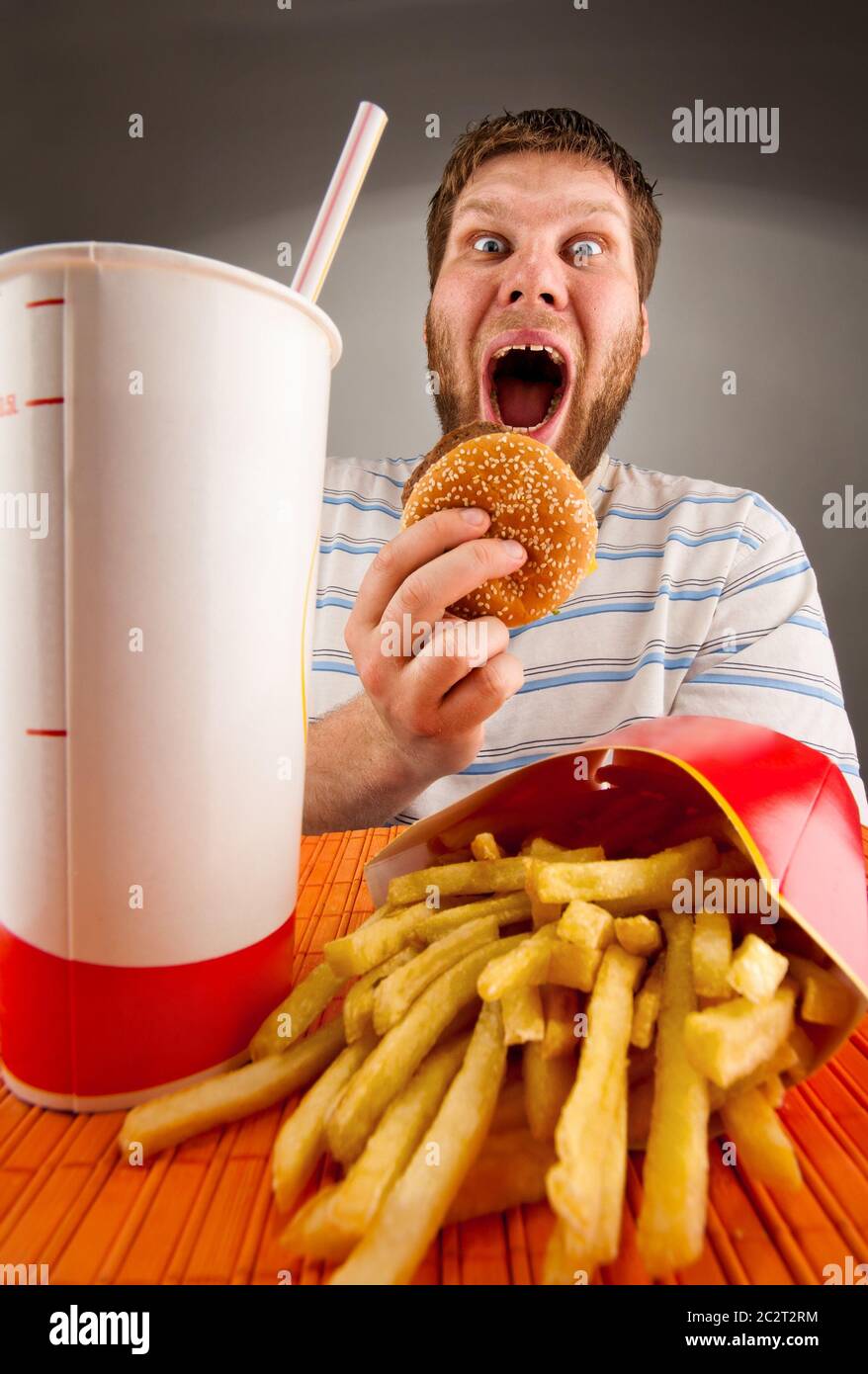 Fat men eating fast food hi-res stock photography and images - Alamy
