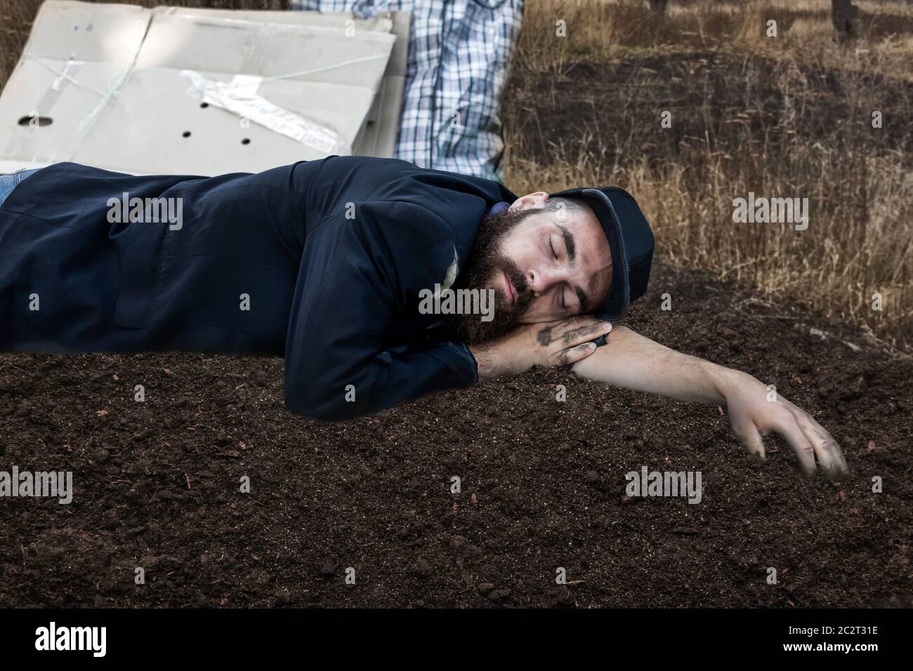 Homeless sleeping on the ground Stock Photo - Alamy