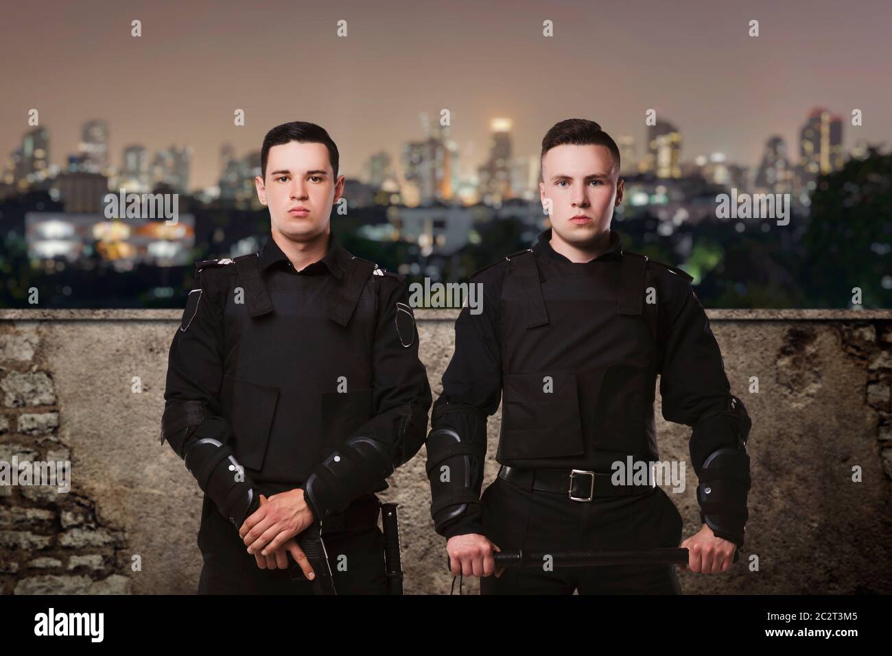 Two cops in uniform on the guard of the law, concept. Special force ...