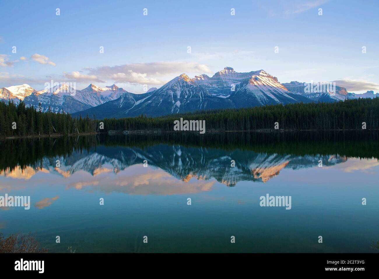 Wonderful reflections on water of Herbert lake at sunset, along ...