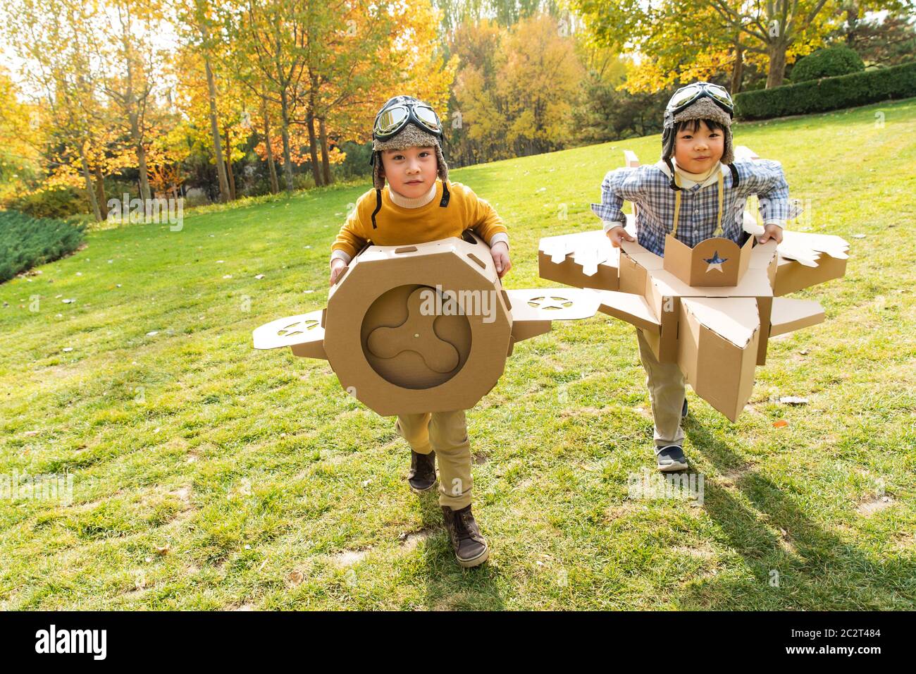 Happy boy play to fly Stock Photo - Alamy