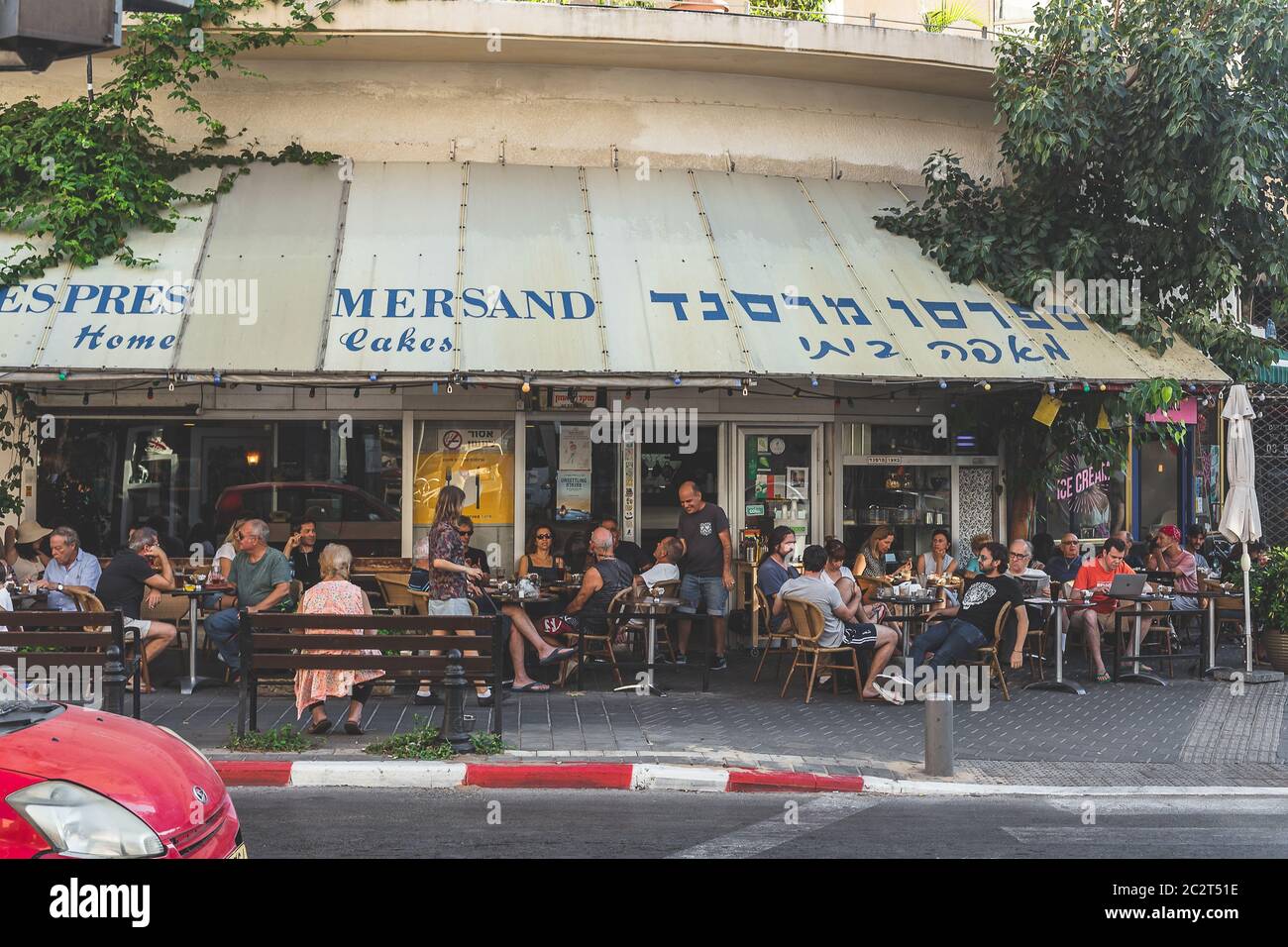 Tel Aviv/Israel-12/10/18: people in the Mersand cafe outdoor sitting ...