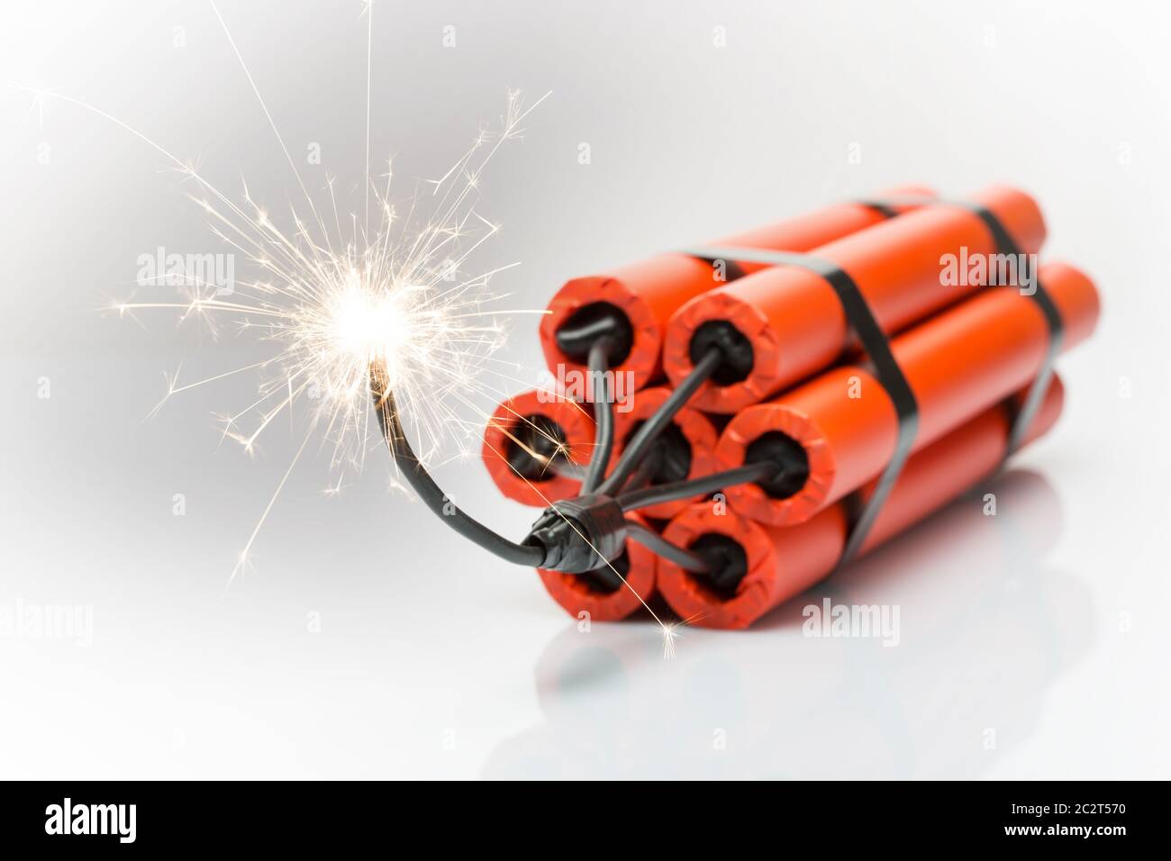 Dynamite pack with burning wick Stock Photo - Alamy