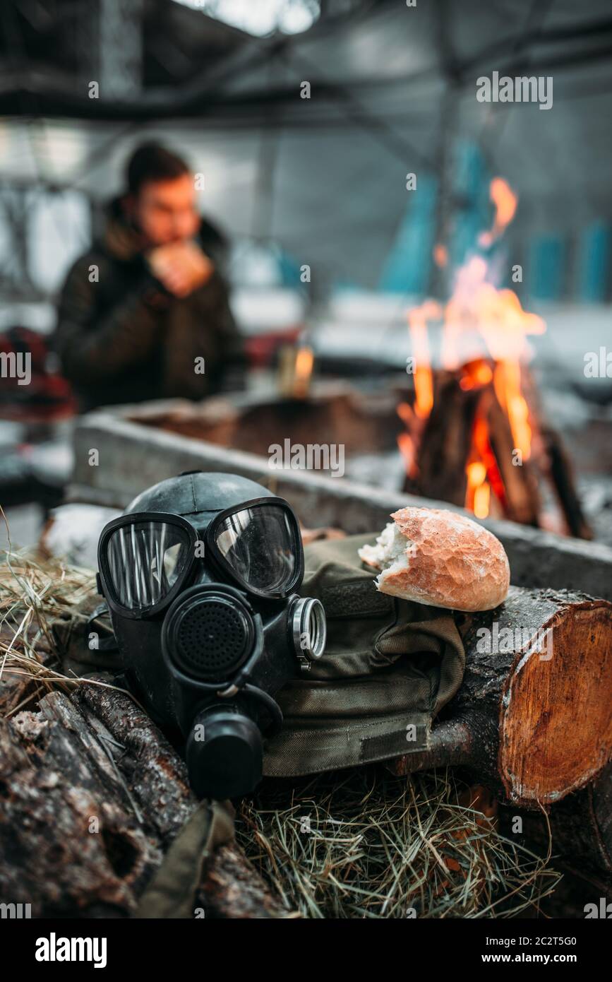 Gas mask against fire, stalker eats on background. Post apocalyptic ...