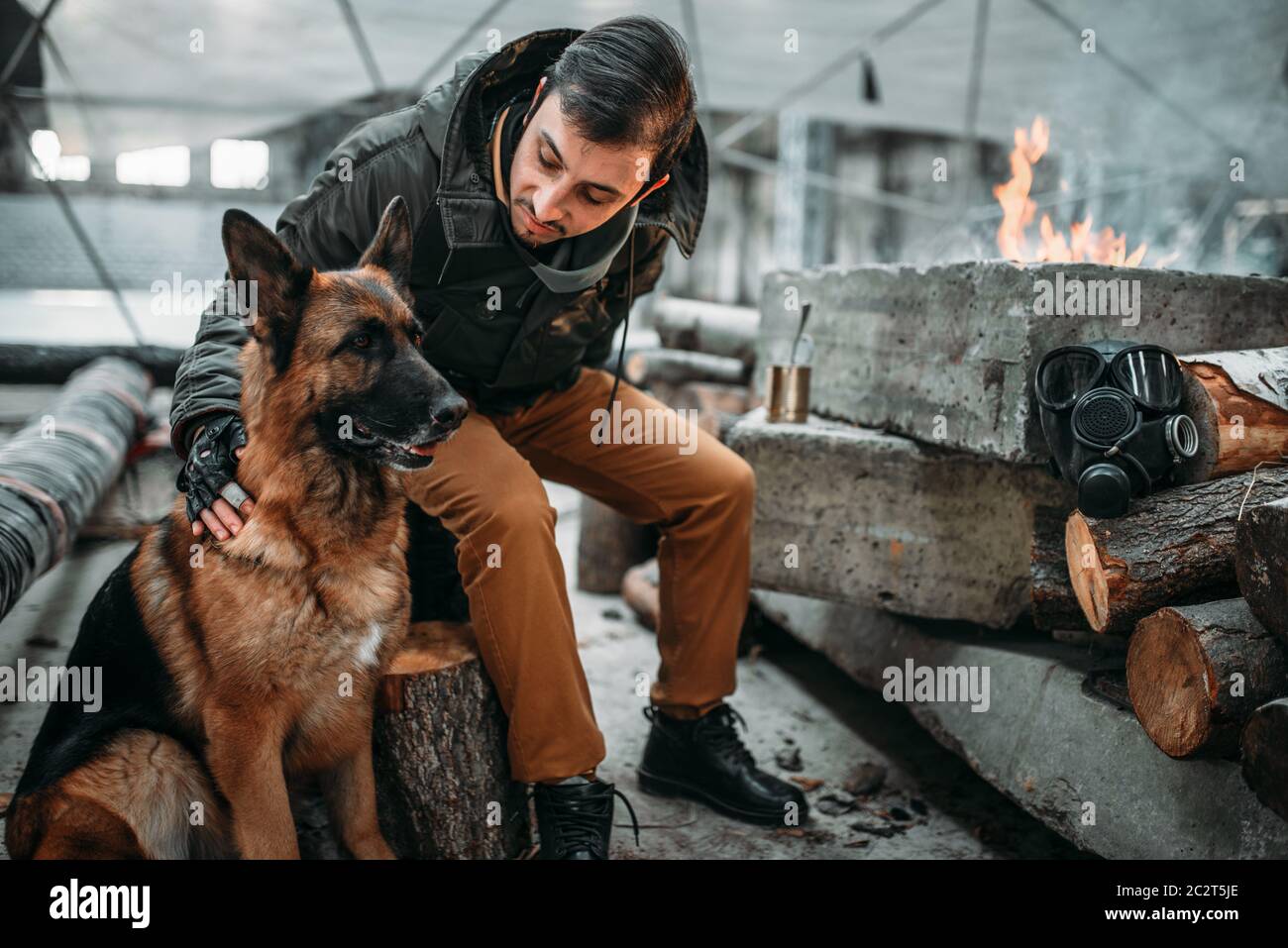 Stalker, post-apocalypse soldier feeding a dog. Post apocalyptic ...