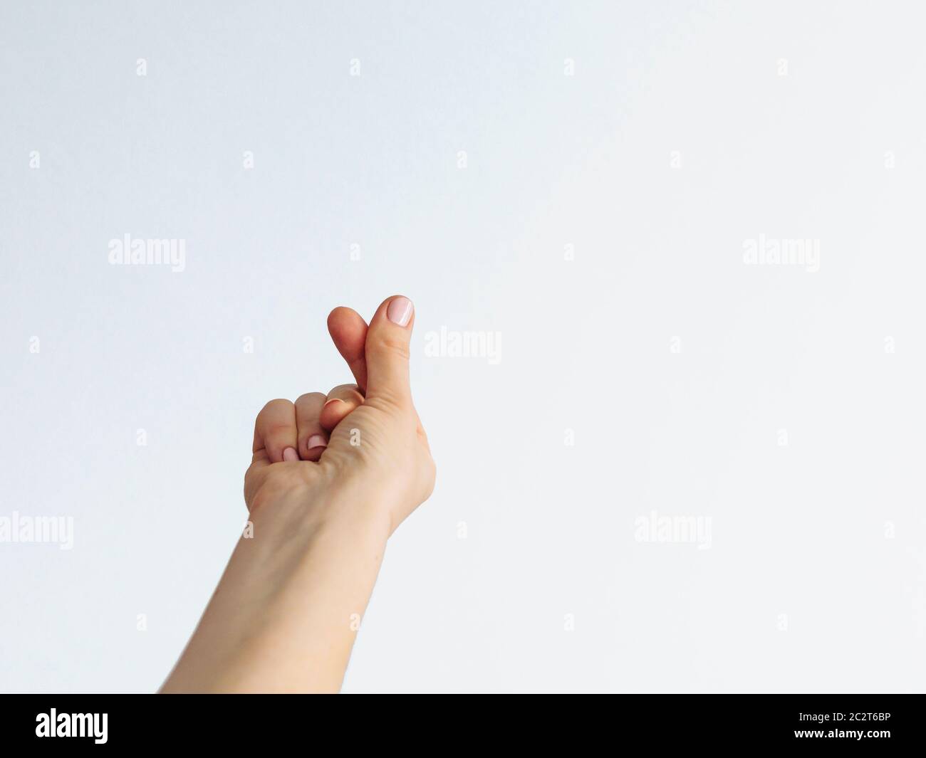 Korean symbol of love with fingers Stock Photo - Alamy