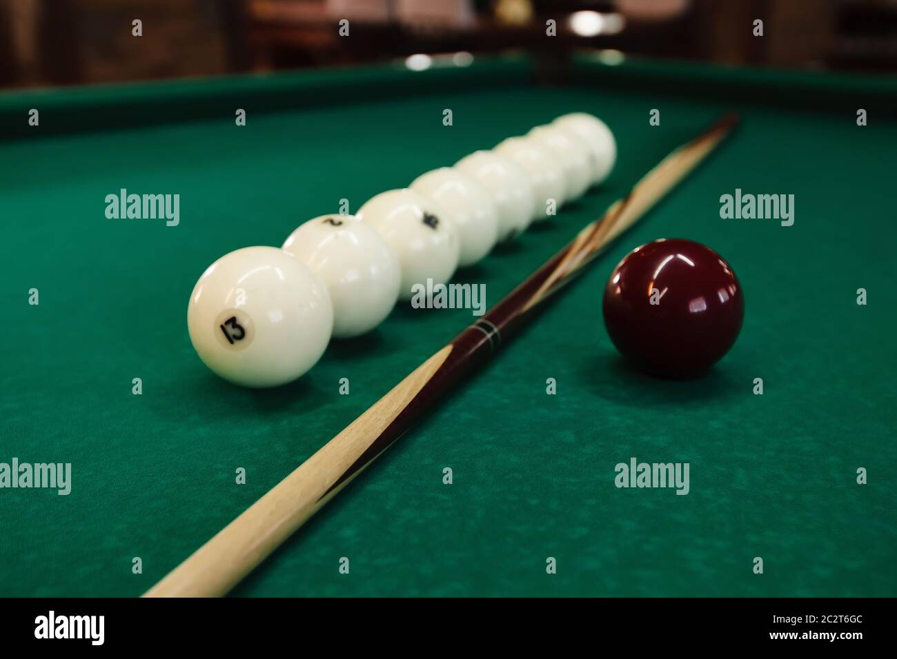 Billiard balls and pool sticks on the green table Stock Photo - Alamy