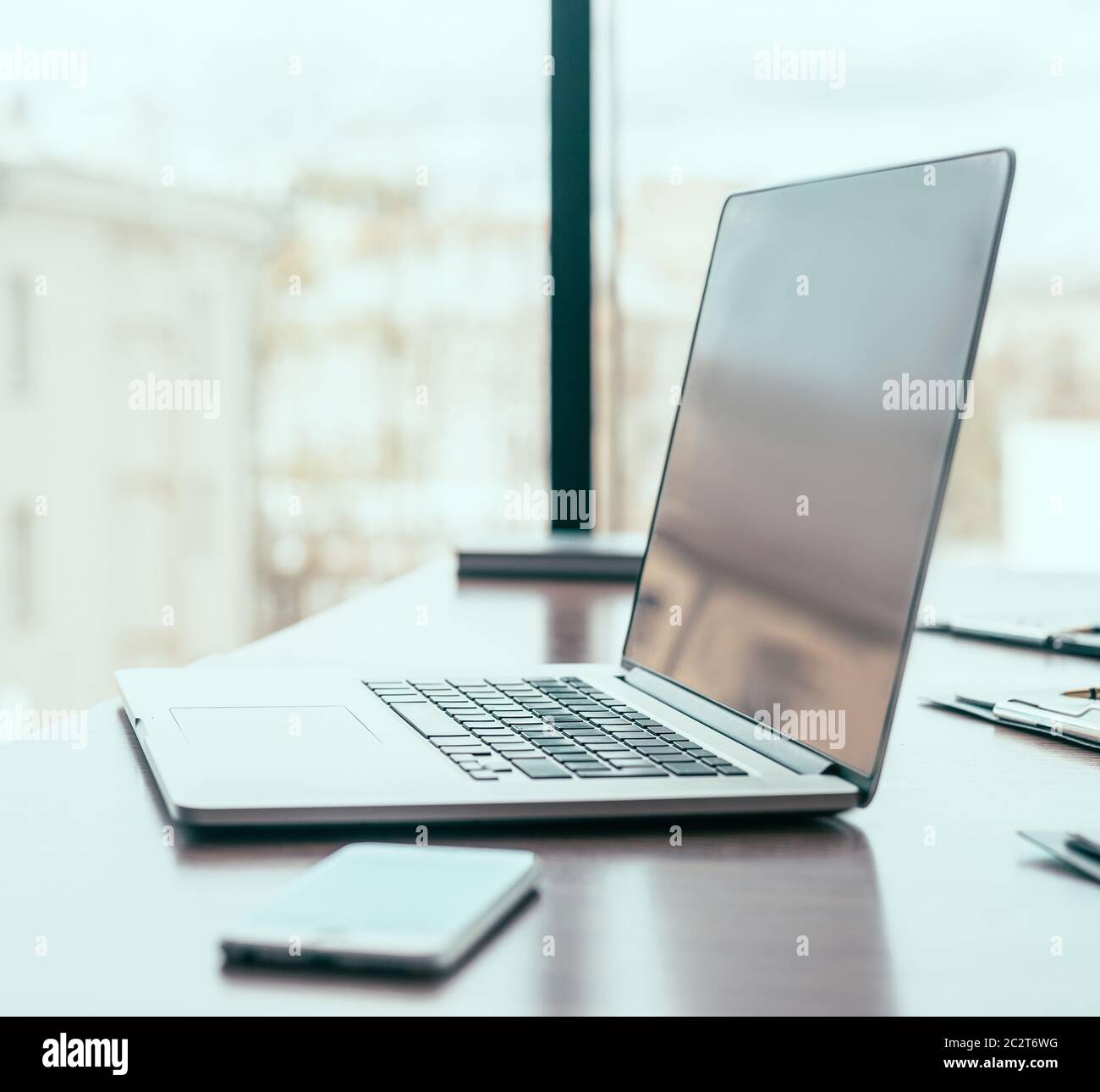 side view. open laptop on the office Desk Stock Photo - Alamy
