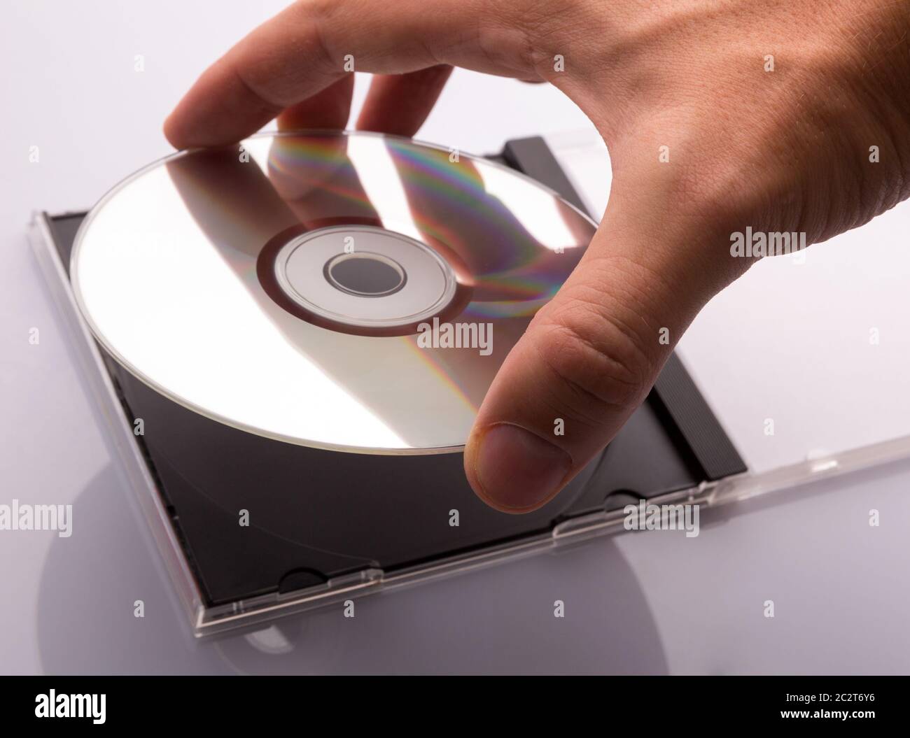 hand taking DVD disc from box Stock Photo - Alamy