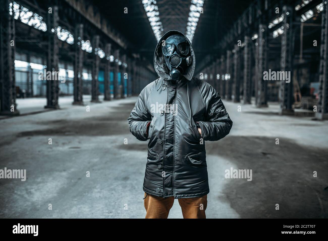 Stalker concept, male person in gas mask in abandoned building. Post ...