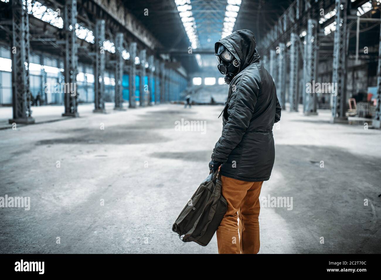Stalker soldier, man in gas mask in abandoned building. Post ...