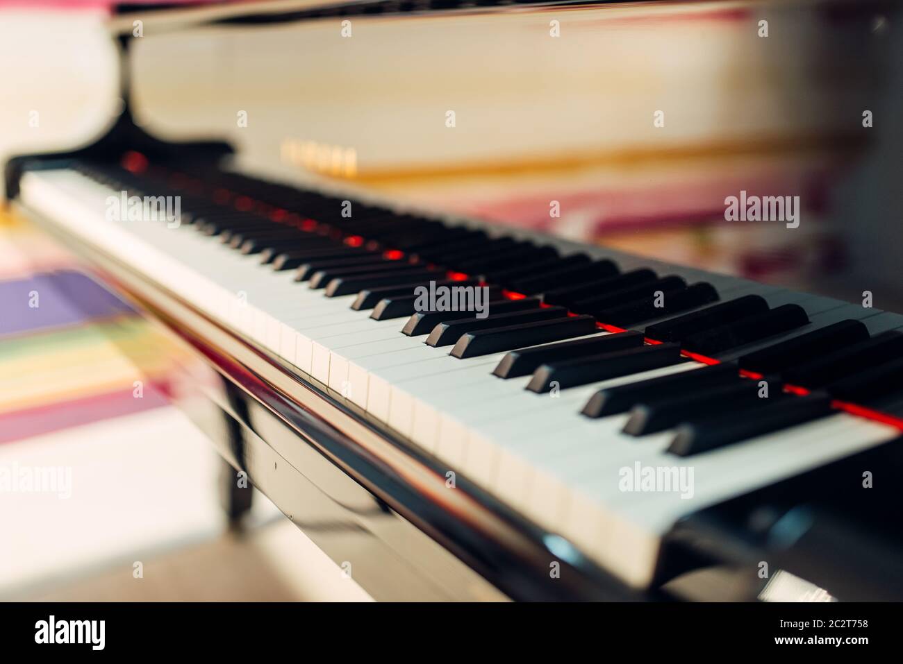 Grand piano keys closeup, nobody. Horizontal macro view of royale ...