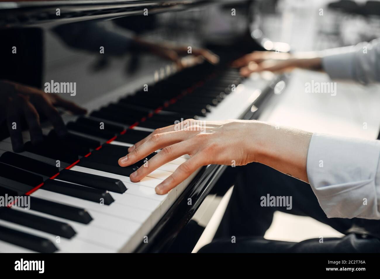 Male pianist hands on grand piano keyboard, top view. Musician ...