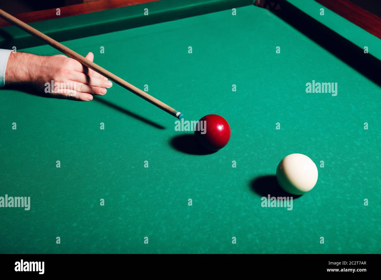 Close up of man preparing to hit while playing billiard Stock Photo - Alamy