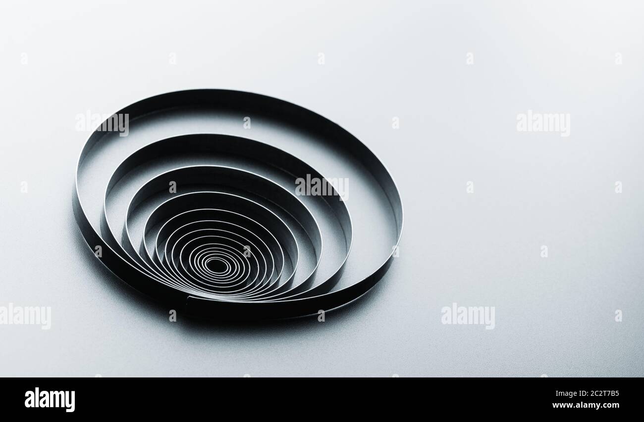 Abstract metallic spring. Toned in blue Stock Photo - Alamy