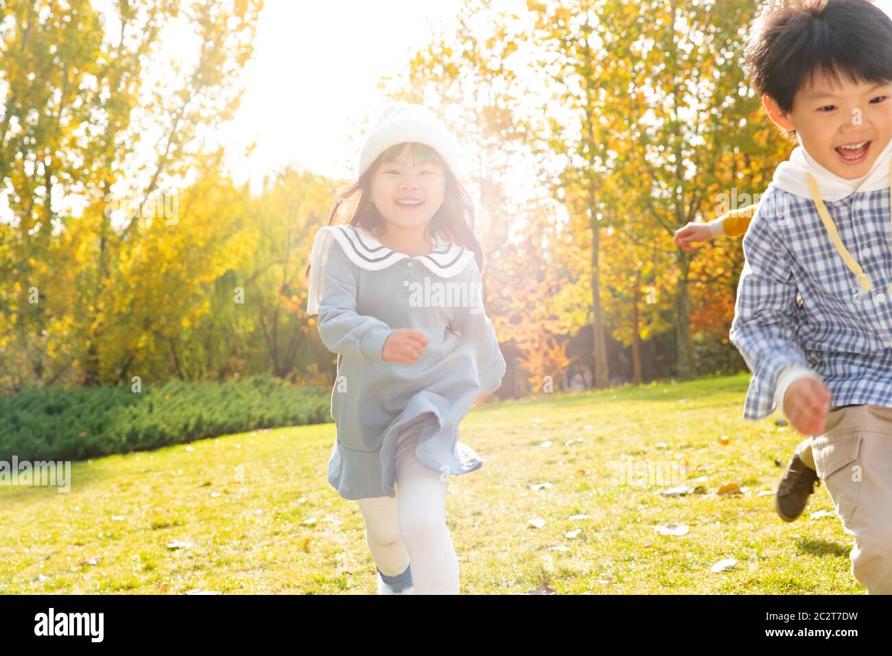 Happy children run to play in the park Stock Photo - Alamy