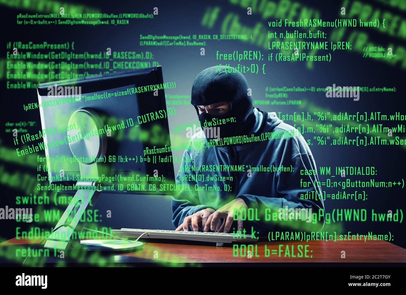 Hacker in mask stealing information in the office Stock Photo - Alamy