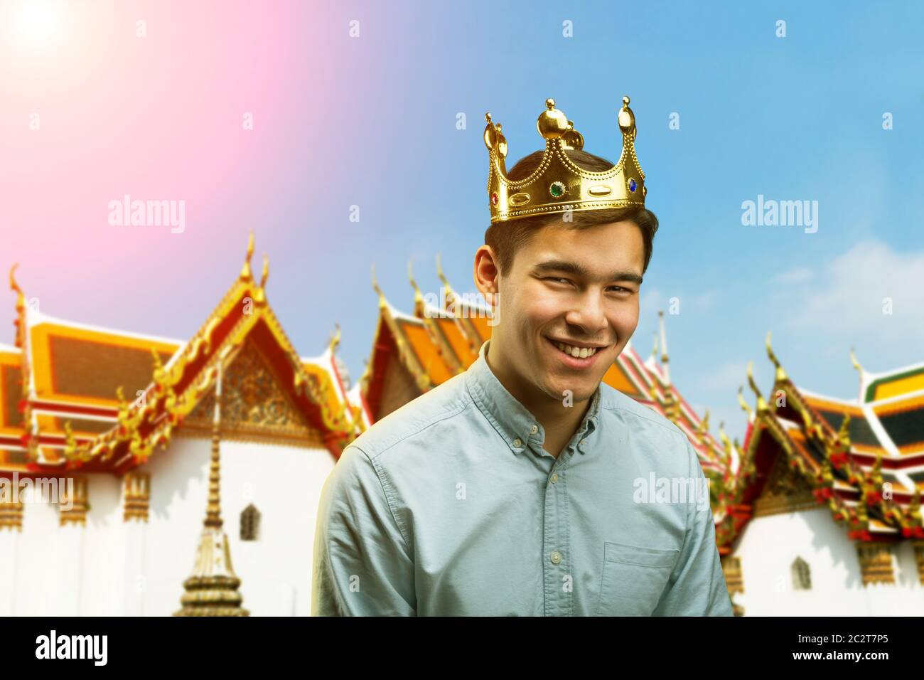 Portrait of a happy prince against asian temple Stock Photo - Alamy