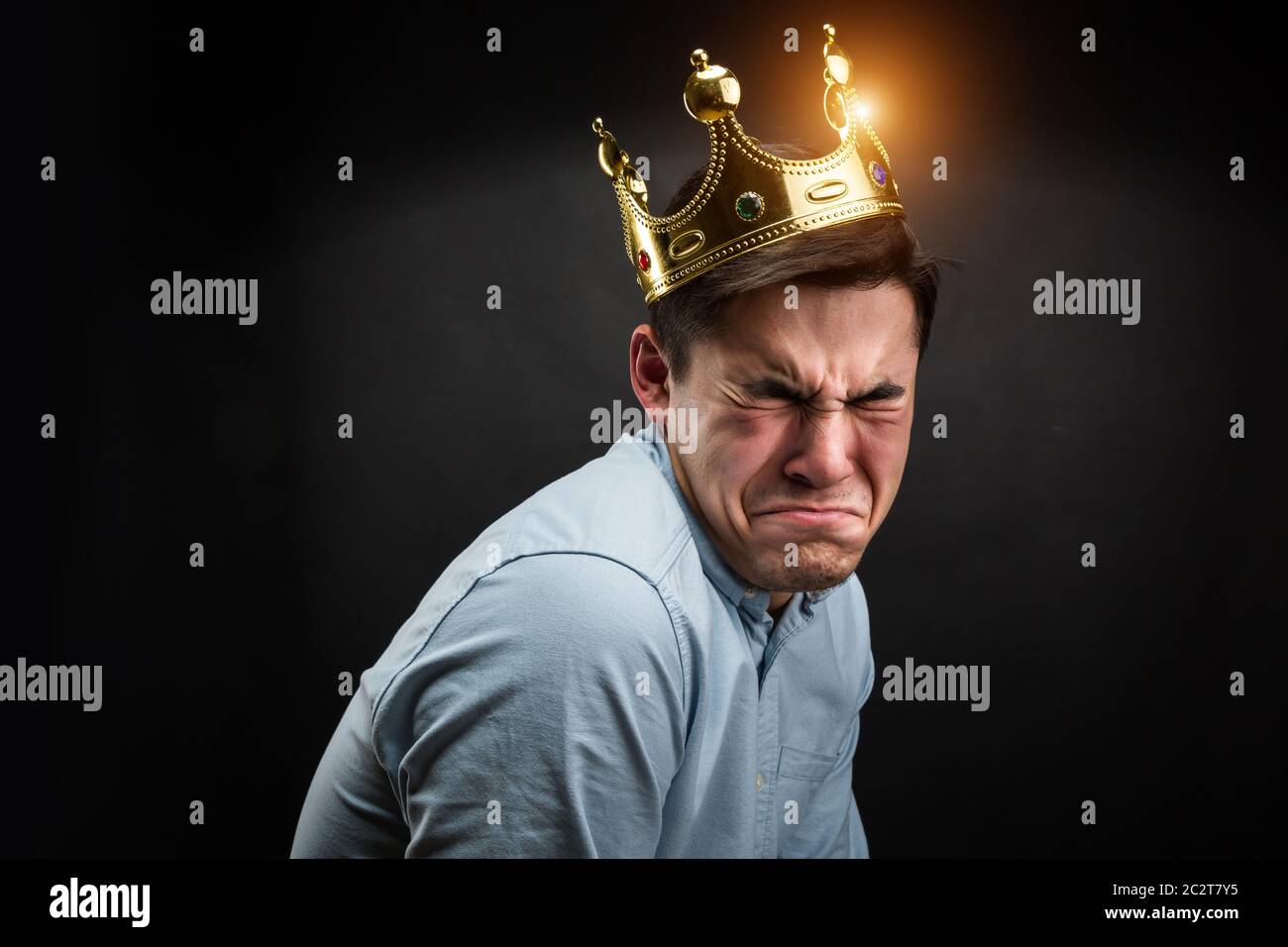 Portrait of a sad crying prince Stock Photo - Alamy