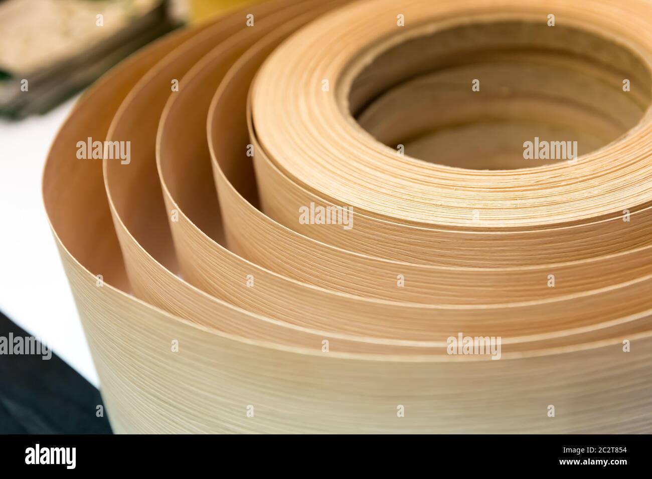 Closeup of veneer material in a roll Stock Photo - Alamy