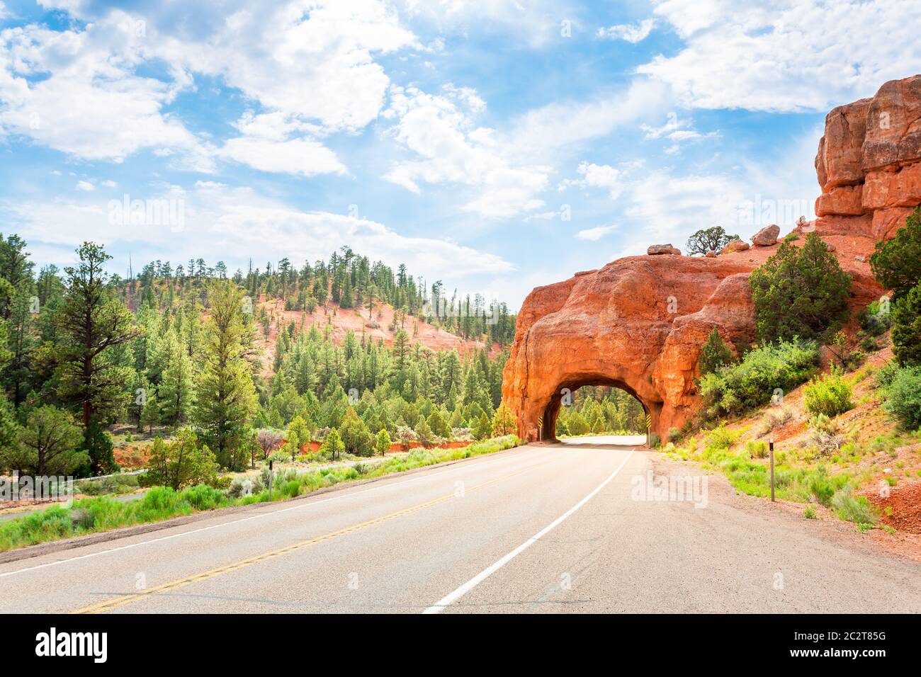 Opening in the rocks with road Stock Photo - Alamy