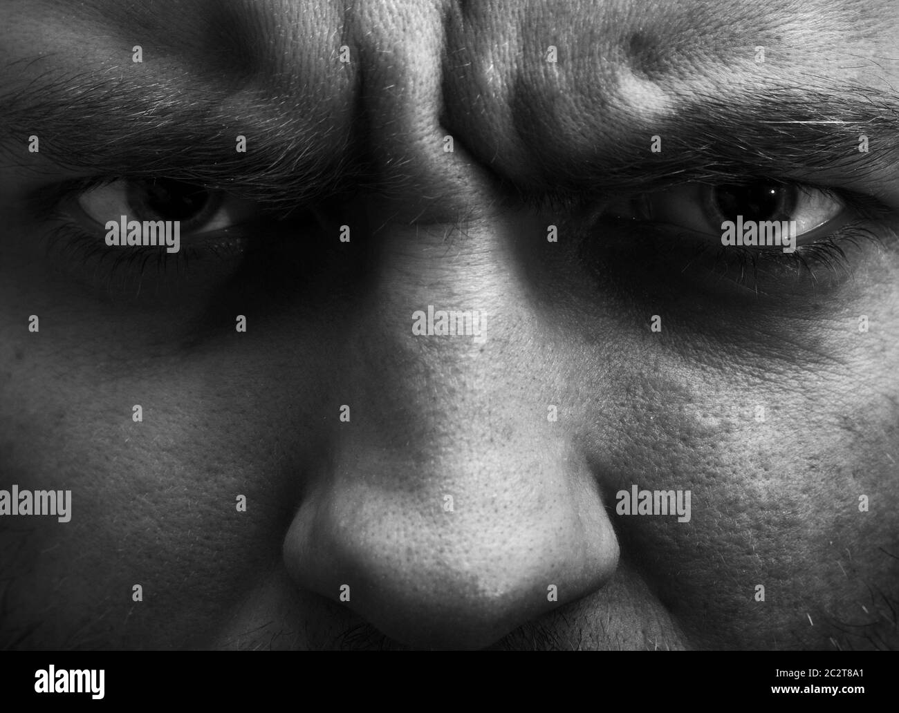 Close-up portrait of angry man. In B/W Stock Photo - Alamy