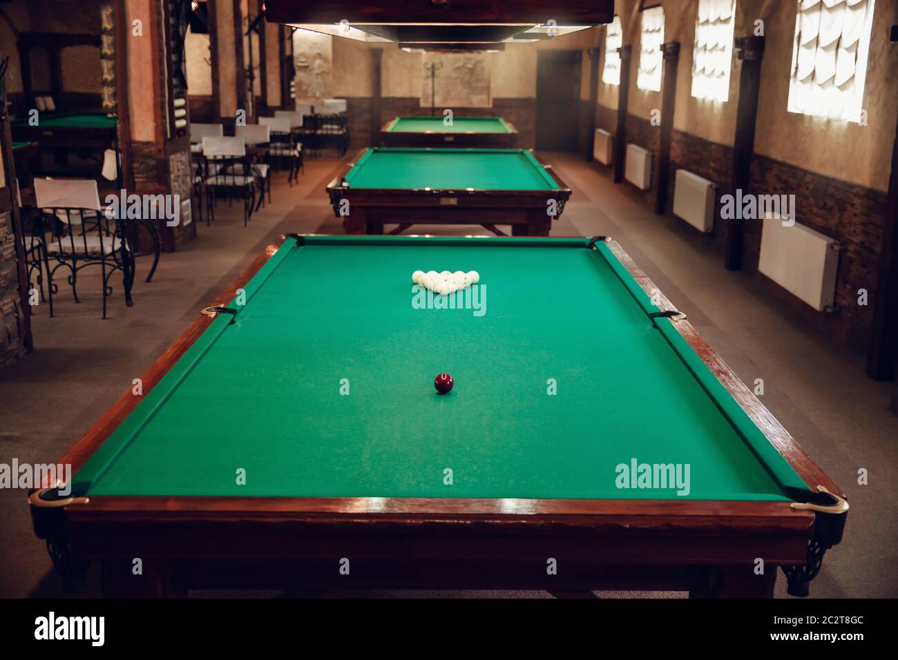 Modern billiard saloon with table prepared for play Stock Photo - Alamy