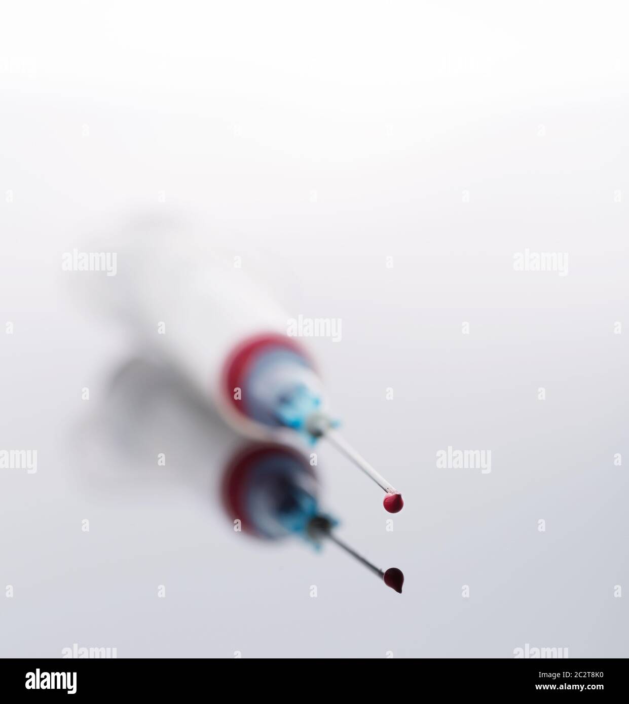 Precision syringe with blood drop Stock Photo - Alamy