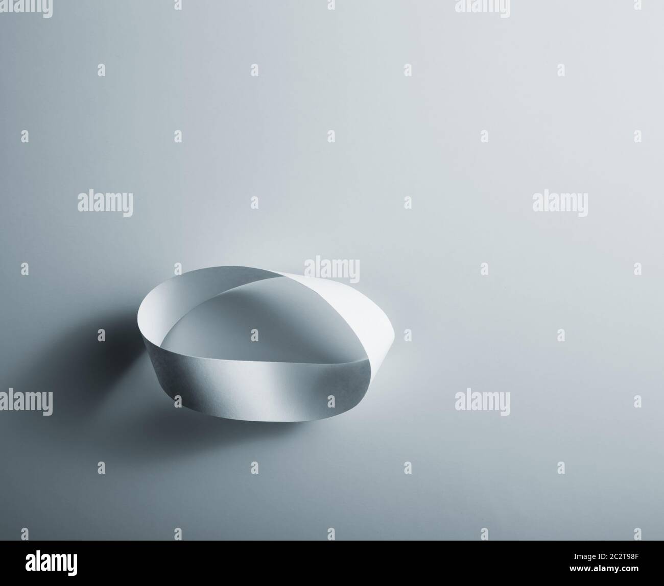 Infinity paper ring on grey background Stock Photo - Alamy