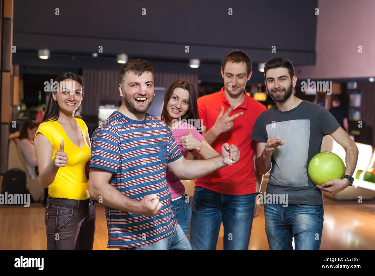 Happy group people bowling having hi-res stock photography and images ...