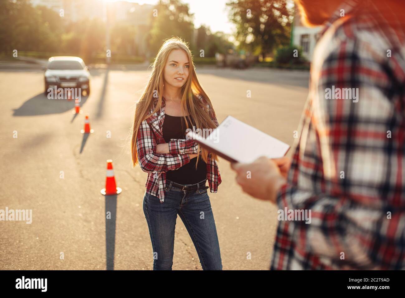 Male instructor and female student, driving school concept. lesson for ...