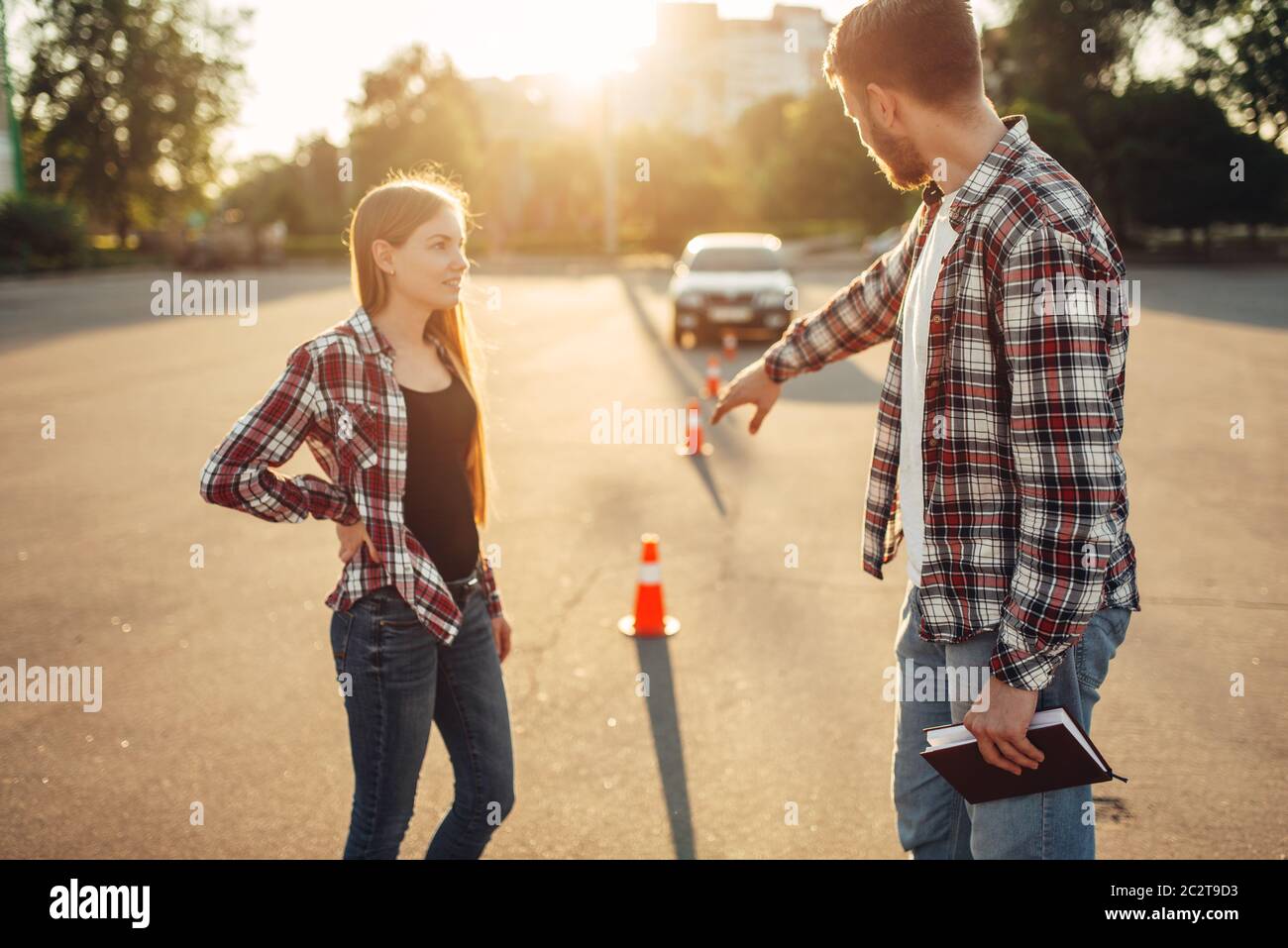 Male instructor and female student, driving school concept. lesson for ...