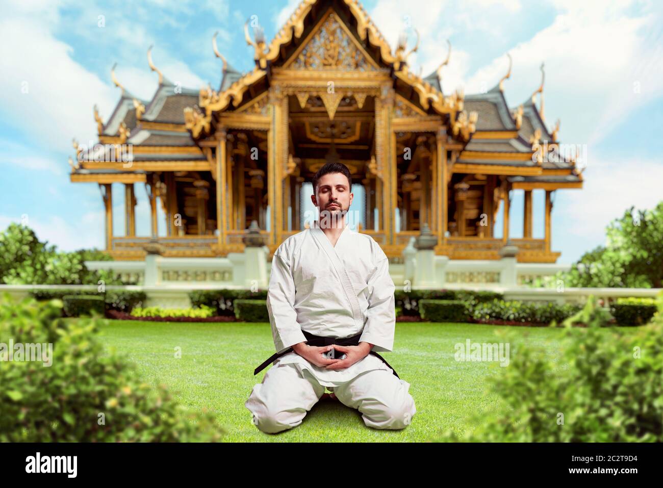 Traditional karate martial arts, fighter in yoga pose, monastery on ...