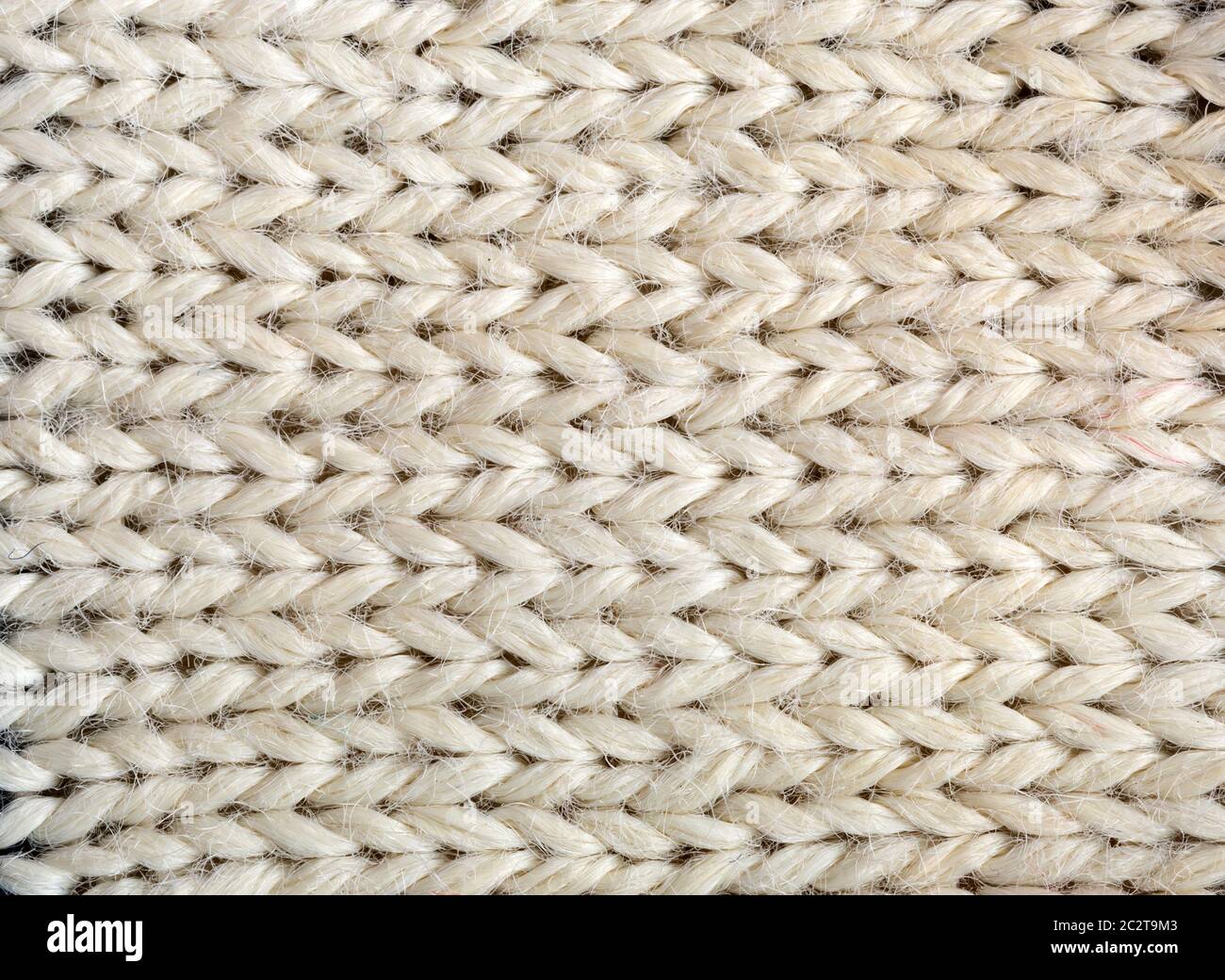 Close up of beige knitted texture Stock Photo - Alamy