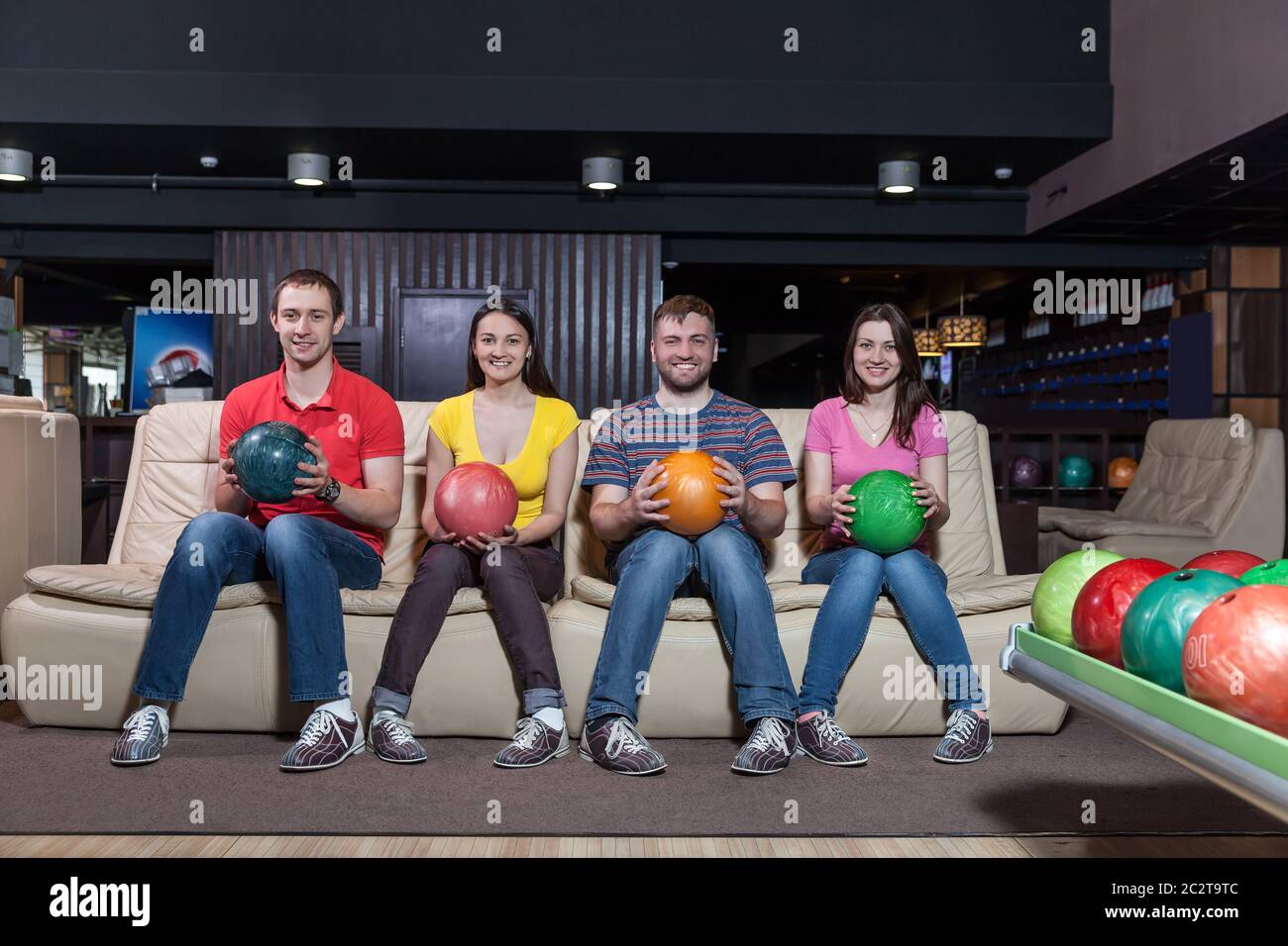 Bowling team sitting on the sofa in bowling Stock Photo - Alamy