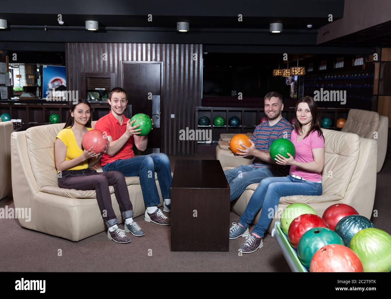 Bowling team sitting on the sofa in bowling Stock Photo - Alamy