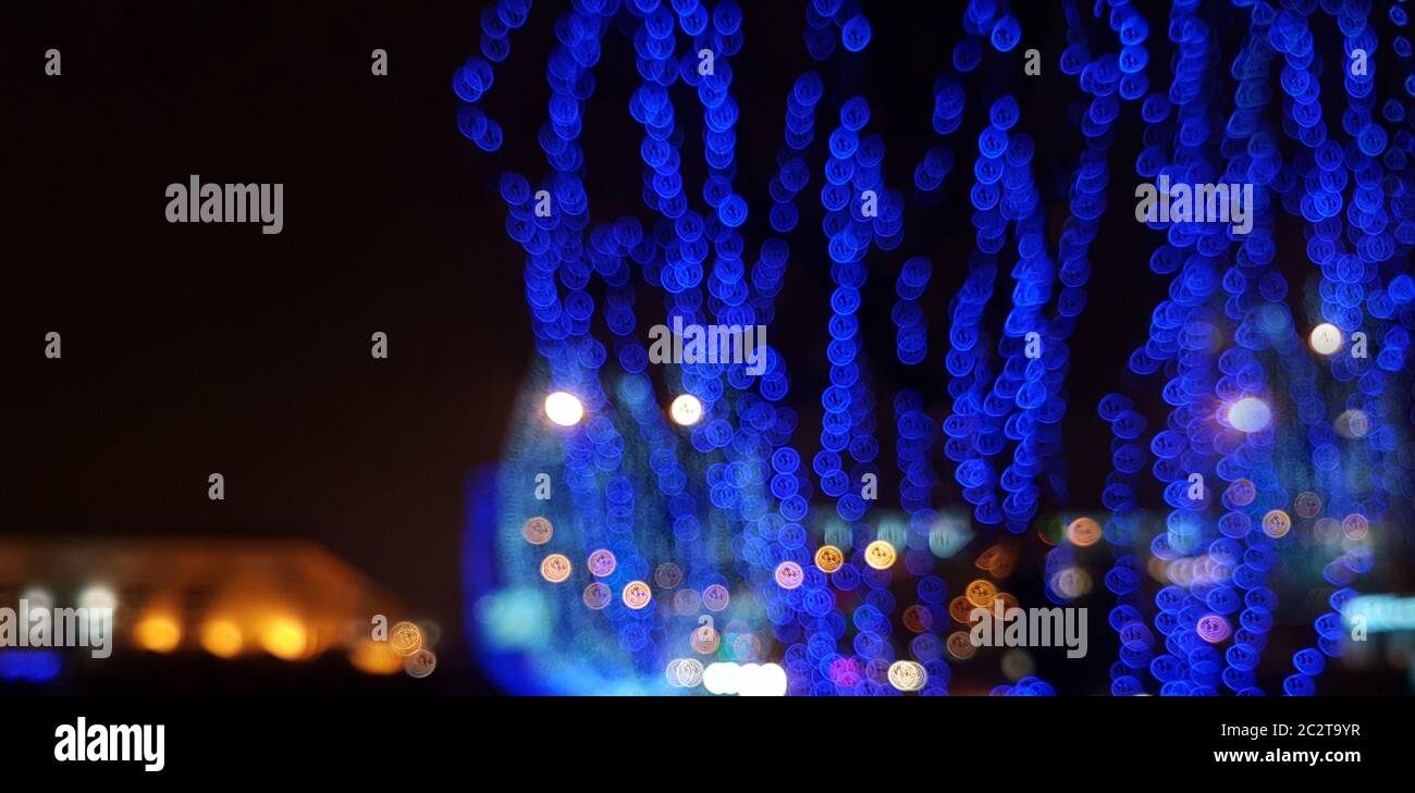blurred image bright colored lights on a night background Stock Photo ...