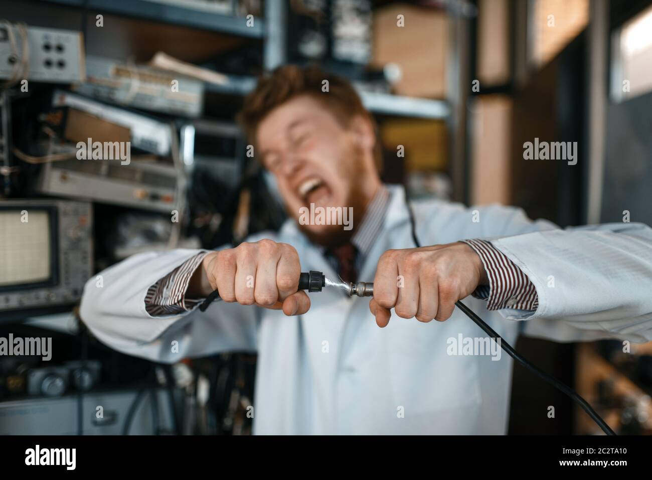 Crazy engineer connects wires under tension in laboratory. Electrical ...